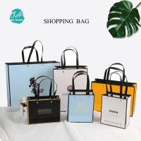 China Custom Printed Paper Shopping Bags 32x11x38cm CMYK Color Luxury Gift Bags with Handles for sale