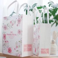 China Custom Kraft Paper Carry Bags 32x11x38cm CMYK Color Luxury Shopping Tote for sale
