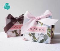 China Luxury Paper Shopping Bags with Bow Tie Ribbon Handle 250gsm Custom Logo for sale