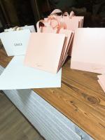 China Luxury Paper Shopping Bags with Bow Tie Ribbon Handle 250gsm Custom Logo for sale