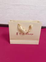 China Luxury Paper Shopping Bags with Bow Tie Ribbon Handle 250gsm Custom Logo for sale
