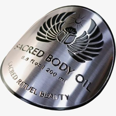 China Customized Metal Logo Label Gold / Rose Gold Embossed Metal Label for sale