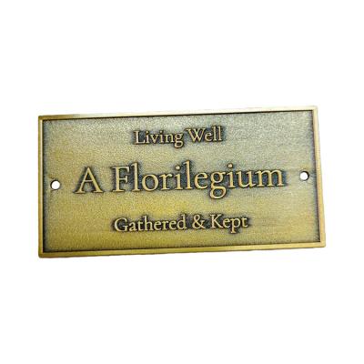 China Custom Vintage Embossed Zinc Alloy Sign With Two Mounting Holes for sale