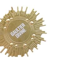 China Gold Sun Burst Pattern Stamped Aluminum Perfume Label With Adhesive Backing for sale