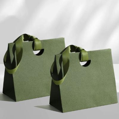 China Custom Logo Premium Texture Paper Handbag 30x20x10cm with Embossed Ribbon for Clothing Stores for sale