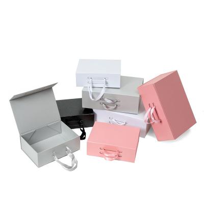 China Custom CMYK Printed Collapsible Paperboard Magnetic Gift Box with Silk Ribbon 500pcs for sale
