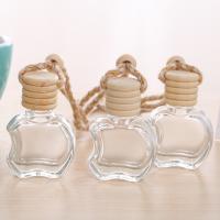 China Apple Shape Glass Car Perfume Bottles Essential Oil Diffuser Aromatherapy Car Air Fresher With Wire for sale