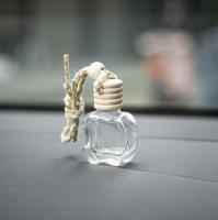 China Apple Shape Glass Car Perfume Bottles Essential Oil Diffuser Aromatherapy Car Air Fresher With Wire for sale