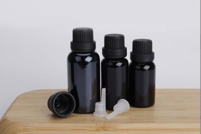 China Black Essential Oil Bottle 5g 10g 15g 20g 30g 50g 100g Cosmetic Glass Bottle With Cap for sale