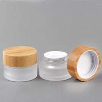 China 5 To 15ml Cosmetic Frosted Glass Jar With Wooden Cap for sale