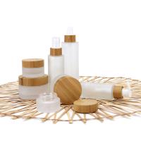 China Glass Cosmetic Containers Bamboo Cosmetic Packaging Bamboo Lid Cream Cosmetic Jar for sale