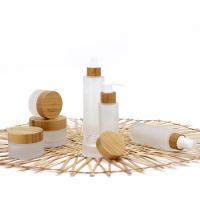 China Glass Cosmetic Containers Bamboo Cosmetic Packaging Bamboo Lid Cream Cosmetic Jar for sale