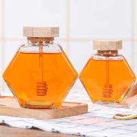 China Wooden Lid 12 Oz 13.4oz Hexagon Glass Honey Jar Transparent for sale