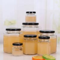 China 730ml Polygon Hexagon Glass Storage Bottles Embossed For Chili Sauce Pickle for sale