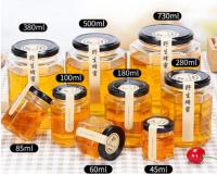 China 730ml Polygon Hexagon Glass Storage Bottles Embossed For Chili Sauce Pickle for sale