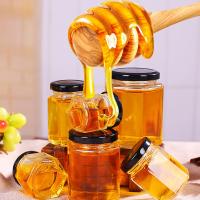 China 730ml Polygon Hexagon Glass Storage Bottles Embossed For Chili Sauce Pickle for sale