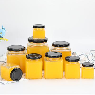 China Square Glass Storage Bottles 750ml 26.5oz Spice Jars With Black Lids for sale