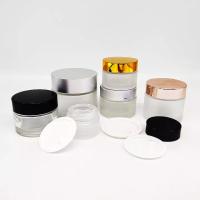 China Cream Clear Frosted Glass Cosmetic Containers Jar 30g To 100g With Silver Lid for sale