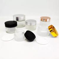 China Cream Clear Frosted Glass Cosmetic Containers Jar 30g To 100g With Silver Lid for sale