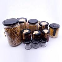 China Eco 25ml 50ml Jam Glass Preserve Jars Clear Glass Canisters With Black Lids for sale