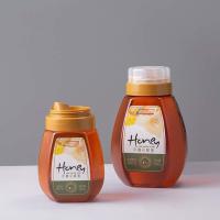 China 300g 500g 1000g Honey Bottles Reflux Inlet Sealing Plastic Seasoning Bottles for sale