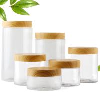 China Cosmetic Clear Plastic Storage Jar Empty Refillable With Bamboo Cap for sale