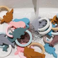 China Cartoon Silicone Baby Teether Toy With Penguin Unicorn Raccoon Shape for sale