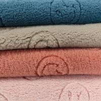 China 100% Polyester Sherpa Fabric Textile Warp Knitted Smilling Face Pattern Embossed for sale