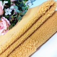 China Warp Knitted Sherpa Fleece Fabric 100% Polyester Yellow Jacquard For Garment for sale