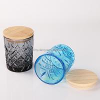 China Factory Custom Clear diamond shaped surface glass jar with lid, Clear 8oz Short Round Glass Jar For Candle Making for sale