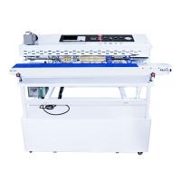 China PLC Control Vertical Band Sealer Machine Laser Coder Foil Film Food Packaging 0-12m/min for sale