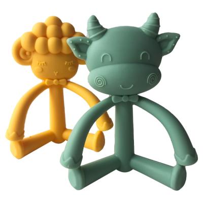 China Custom Cartoon Silicone Baby Teether , Food Grade Silicone lnfant Training Toothbrush  Cow And Sheep Shapes for sale
