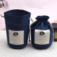 China Custom Logo Dark Blue Round Bottom Jute Drawstring Bag 10x20cm Candle Packing for sale