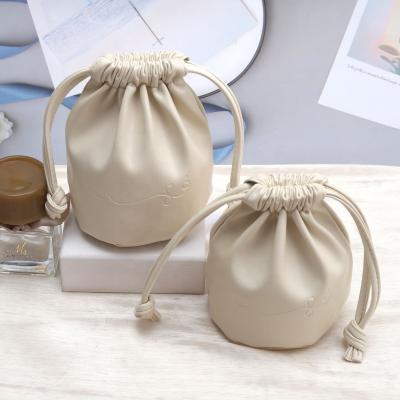 China Custom Logo PU Leather Drawstring Pouch 15x20cm Golf Divot Tool Ball Packing Bag for sale