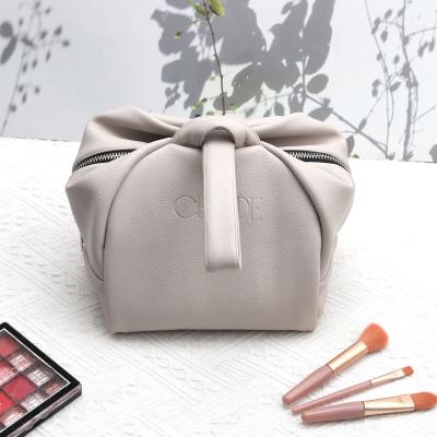 China Custom Logo Waterproof PU Leather Cosmetic Bag with Handle 4x6 Inch Portable Makeup Pouch for sale