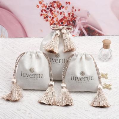 China Custom Logo Cotton Linen Drawstring Gift Pouch with Tassel 12x18 cm for sale