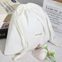 China Custom Organic Muslin Cotton Drawstring Dust Bag 20x30cm with Fabric Label for Cosmetic Underwear Storage for sale