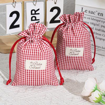 China Reusable Red Plaid Cotton Drawstring Packing Bag with Fabric Label 20x25cm for Perfume Storage for sale