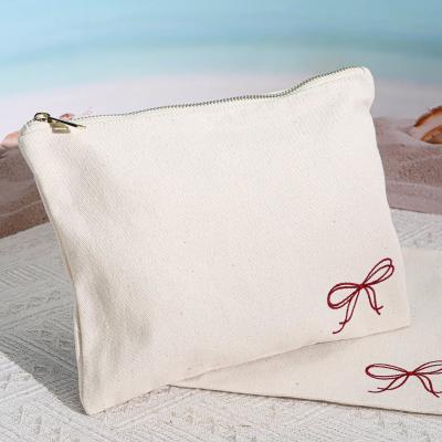 China Eco-friendly Natural 8oz Canvas Makeup Zipper Bag Customized Embroidery Logo Brush Cosmetic Storage Zipper Canvas Pouch for sale