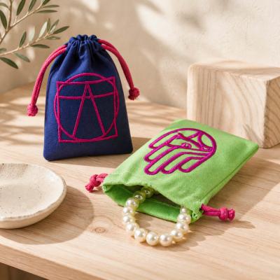 China Custom Embroidered Canvas Drawstring Pouch Colorful Jewelry Gift Bag With Contrast Cord Reusable Packaging for sale