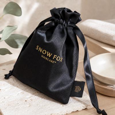 China Custom Matte Satin Drawstring Cosmetic Pouch With Fabric Label Luxury Black Satin Drawstring Packaging Bag For Perfume Jewelry for sale