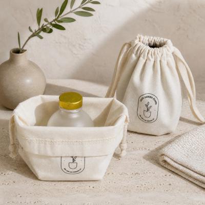 China Eco-friendly Canvas Drawstring Plant Packing Bag with square Bottom Custom Natural Cotton Canvas Drawstring Candle Dust Pouch for sale