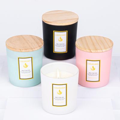 China Customized Logo Glass Jar Scented Candle Colored Soy Based Scented Candles for sale
