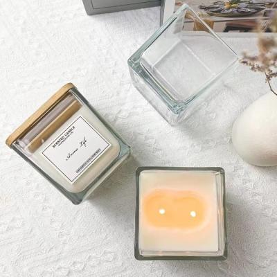 China Scented Empty Glass Candle Jars With Custom Lid Applique Glossy Square Glass Bottle for sale