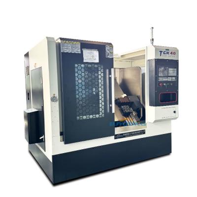 China Flat Bed Cnc Lathe TCK40 Gang Type Tool Holder And Flying Cutting Head Hydraulic Chuck for sale