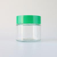China Smooth Round Glass Weed Flower Candy Storage Container With Child Resistant Screw Cap for sale