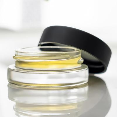 China 7ml Low Profile Thick Cosmetic Glass Jars with Black Lids for Concentrate Oil Lip Balm Cream for sale