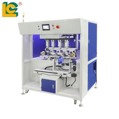 China Ironing four color servo rotary shuttle pad printing machine for sale