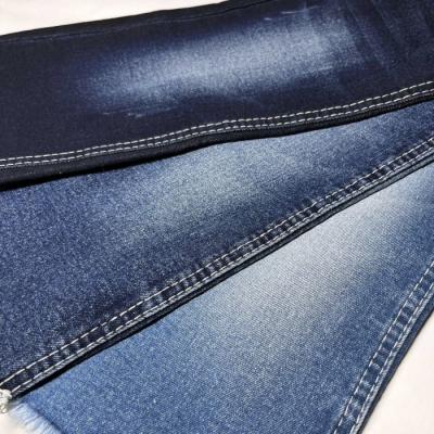 China 10.9 Oz Plain Twill Denim Fabric High Color Fasten Jeans Material for sale