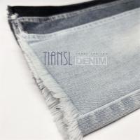 China 9.6 Oz Indigo Blue Black Denim Jeans Fabric Material Primary Fiber Super Soft Yarn for sale